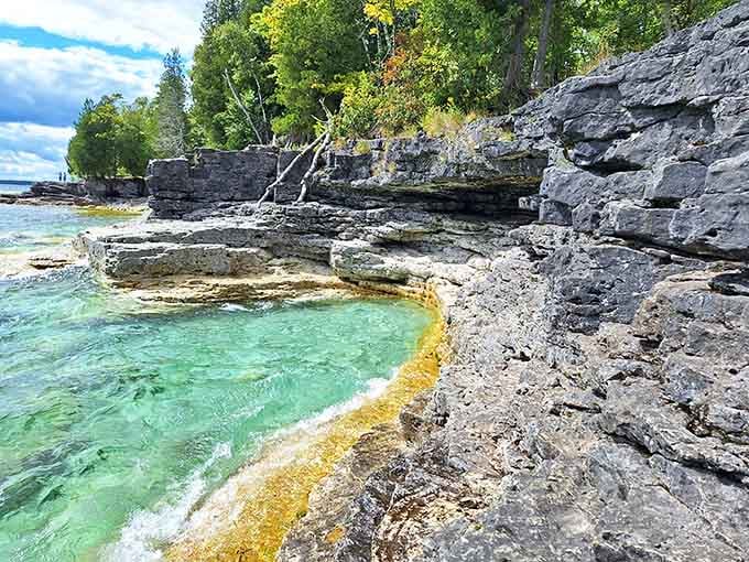 Ancient limestone formations creating natural pools that look like nature's own infinity pools here.