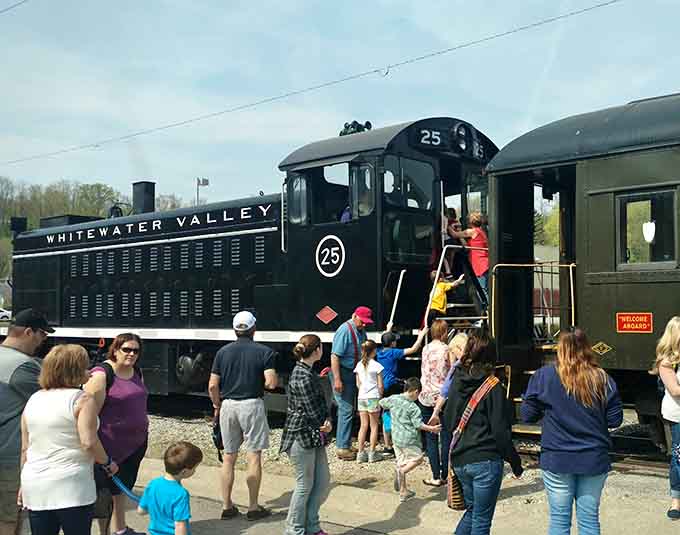 Families gather around locomotive number 25, creating memories that'll outlast any smartphone photo they're taking.