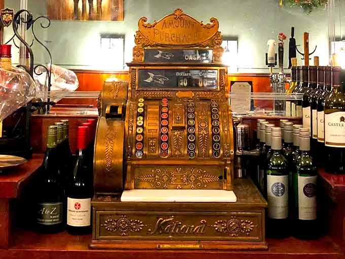 That ornate vintage cash register is a stunning piece of history that probably has better stories than most people.