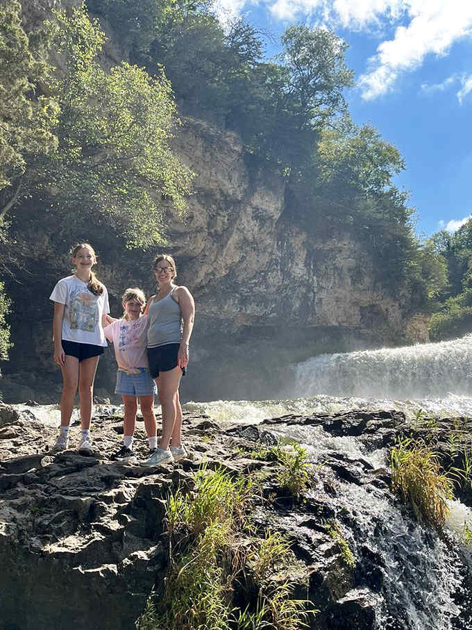 Families creating memories at the falls, capturing moments that'll end up in frames on mantels back home.