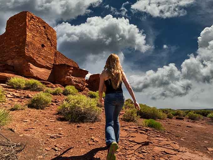 Exploring ruins under dramatic skies that add cinematic flair to your archaeological adventure.