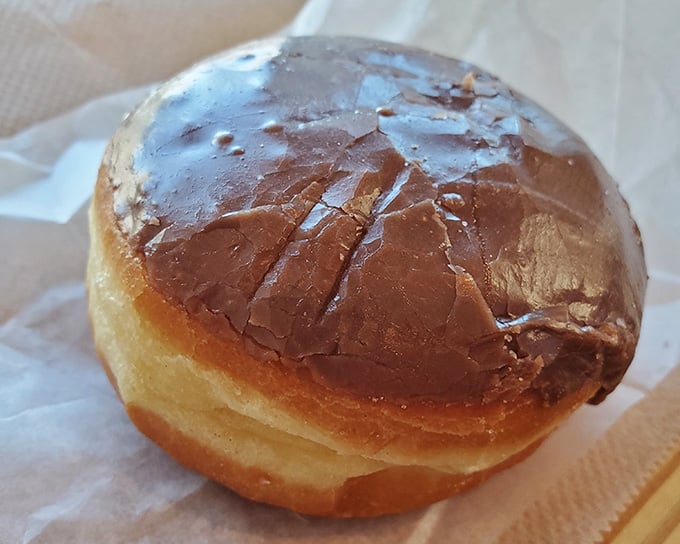 A perfectly filled donut with generous cream filling is proof that good things really do come to those who wait.