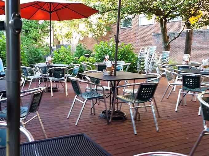 Outdoor patio seating surrounded by greenery, the ideal spot for breakfast when Kentucky weather cooperates beautifully.