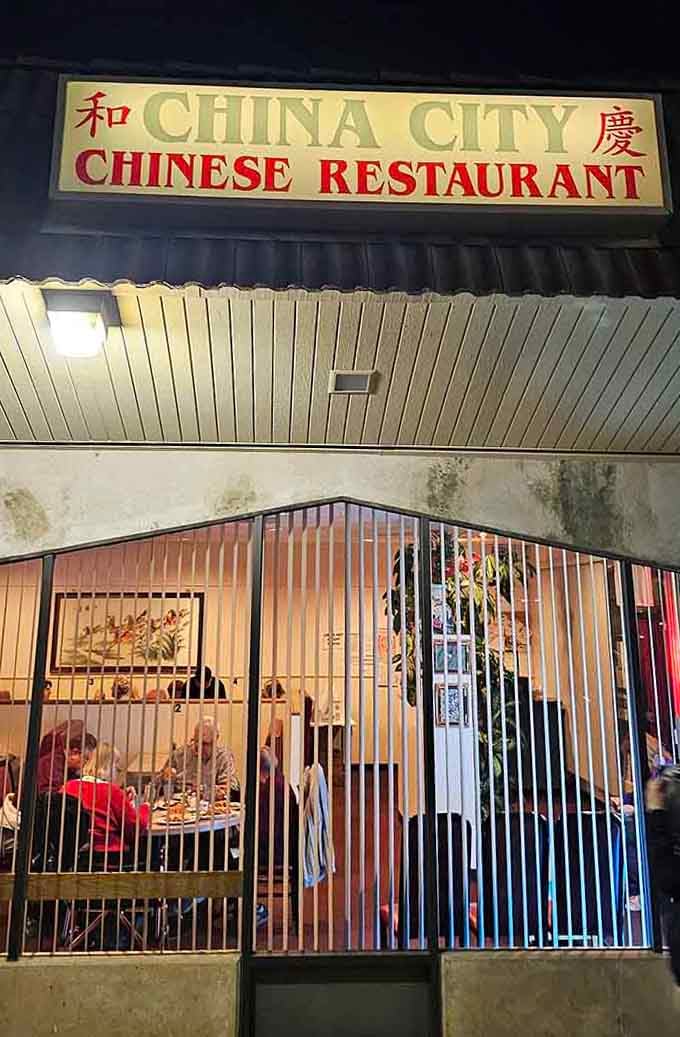 The simple storefront glows warmly at night, inviting neighbors in for Chinese comfort food done exactly right.