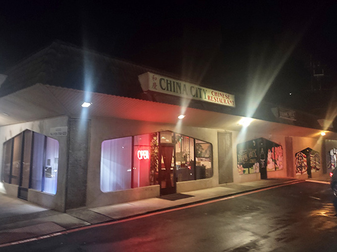 Evening lights illuminate this neighborhood gem where generations have gathered for reliable Chinese-American classics that satisfy completely.