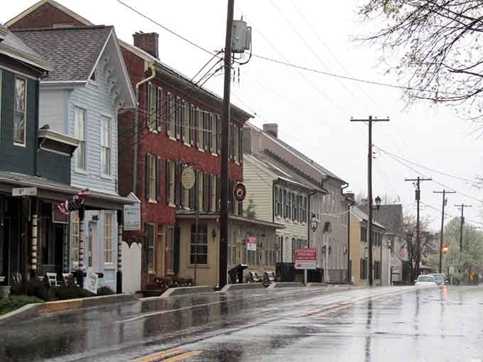 Rain-slicked streets reflect historic buildings, doubling the charm like nature's own special effect.