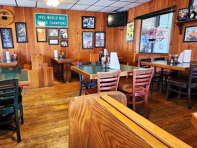 Championship plaques and wood paneling create an atmosphere where barbecue history lives and breathes daily.