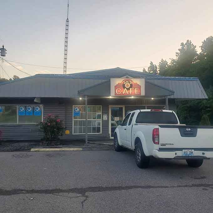 The exterior at dusk glows with welcoming warmth, beckoning hungry travelers to step back in time.