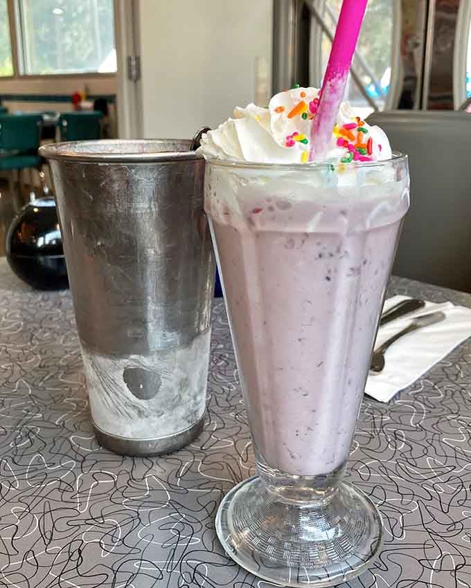 That blackberry milkshake comes with the metal mixing cup, because some traditions are too good to abandon.