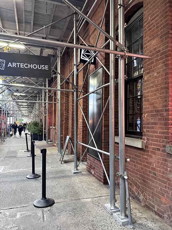 Exposed brick meets cutting-edge technology at the entrance, where Chelsea's industrial past greets its digital future.