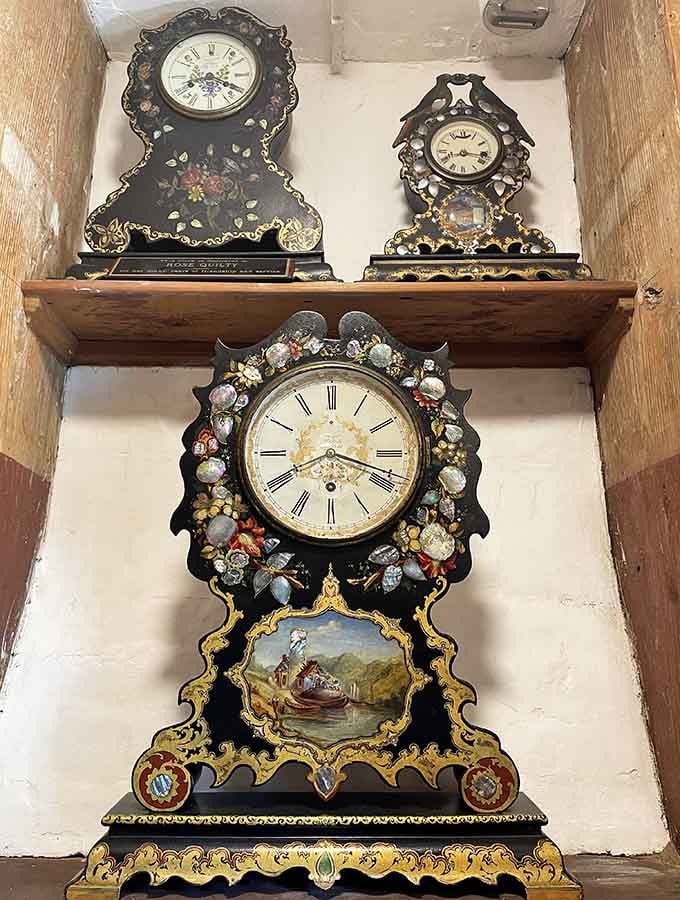 This ornate floral masterpiece looks like someone decided clocks needed more romance, then added mother-of-pearl for good measure.