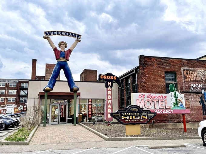 The exterior view shows multiple rescued signs standing proud, a colorful testament to American commercial art and ambition.