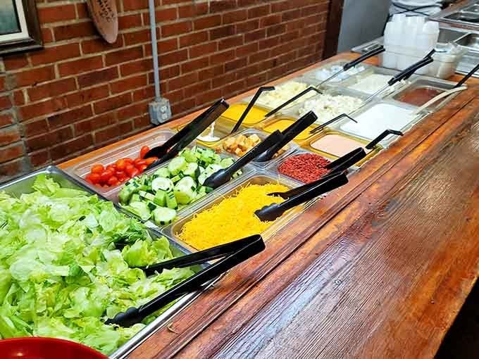 The salad bar's rainbow of fresh vegetables offers crisp lettuce, cucumbers, tomatoes, and shredded cheese for building your perfect starter.