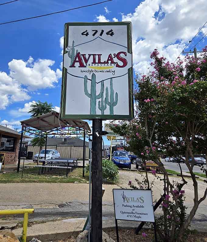 The cactus-adorned sign promises homestyle Tex-Mex cooking, standing tall like a beacon for hungry travelers seeking authentic flavors.