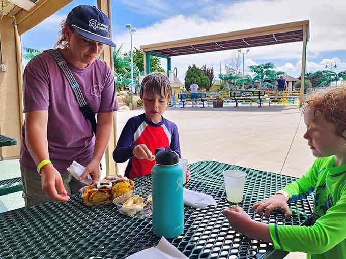 Families refuel between adventures, because even the most enthusiastic fun-seekers need snacks and a moment to breathe.