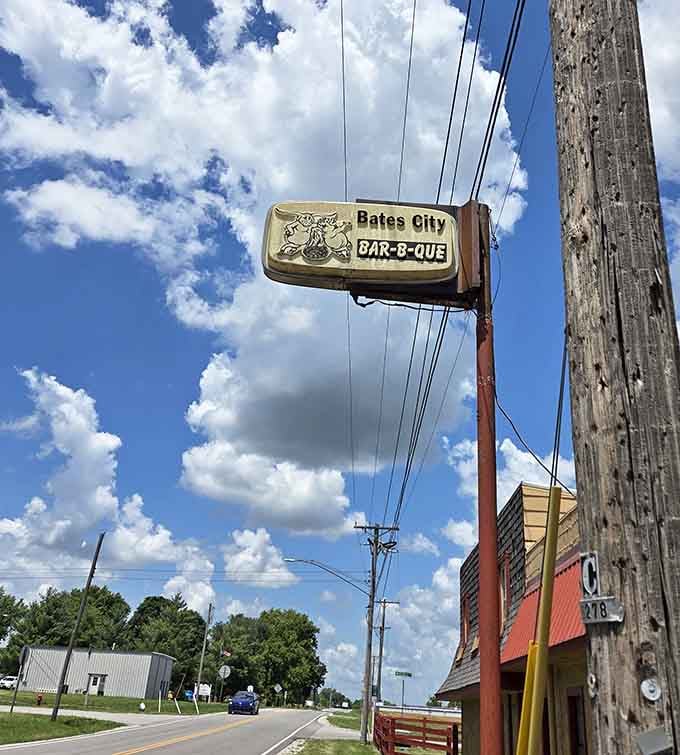 That vintage sign hanging above the street has been calling hungry travelers to barbecue bliss for decades now.