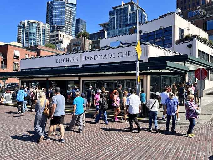 Crowds gather outside Beecher's like pilgrims at a shrine, and honestly, that's not far from the truth.