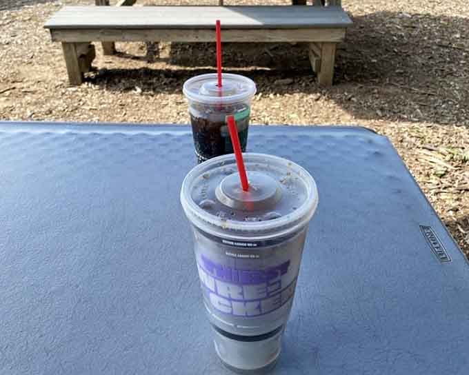 Two frosty drinks waiting on a picnic table represent the perfect ending to any burger pilgrimage worth taking.