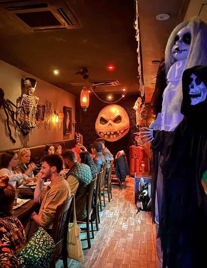 Happy diners surrounded by Halloween decor prove that spooky and delicious aren't mutually exclusive concepts.