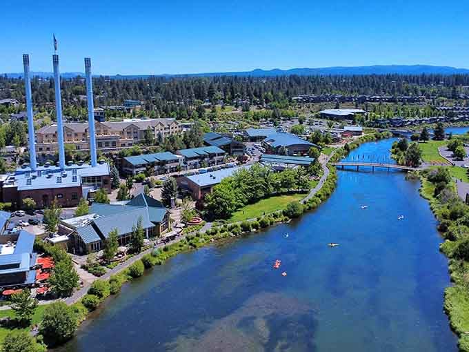 The Old Mill District from above, where shopping, dining, and river recreation converge in one impossibly scenic location.