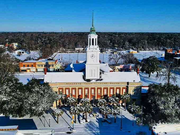 Snow blankets the courthouse in a rare winter scene that transforms this Southern town into a postcard-perfect winter wonderland.