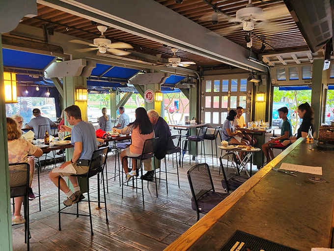 Happy diners enjoying their meals in the bright, welcoming space that's been serving Williamsburg for decades.