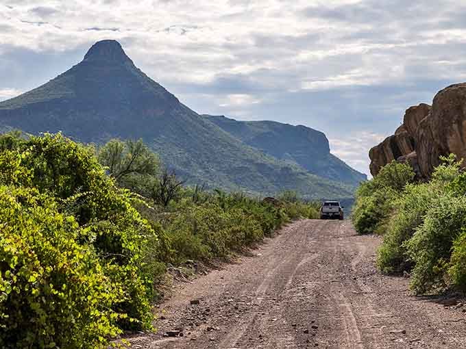 Dirt roads lead to vistas that'll stop you in your tracks, with mountains rising majestically ahead.
