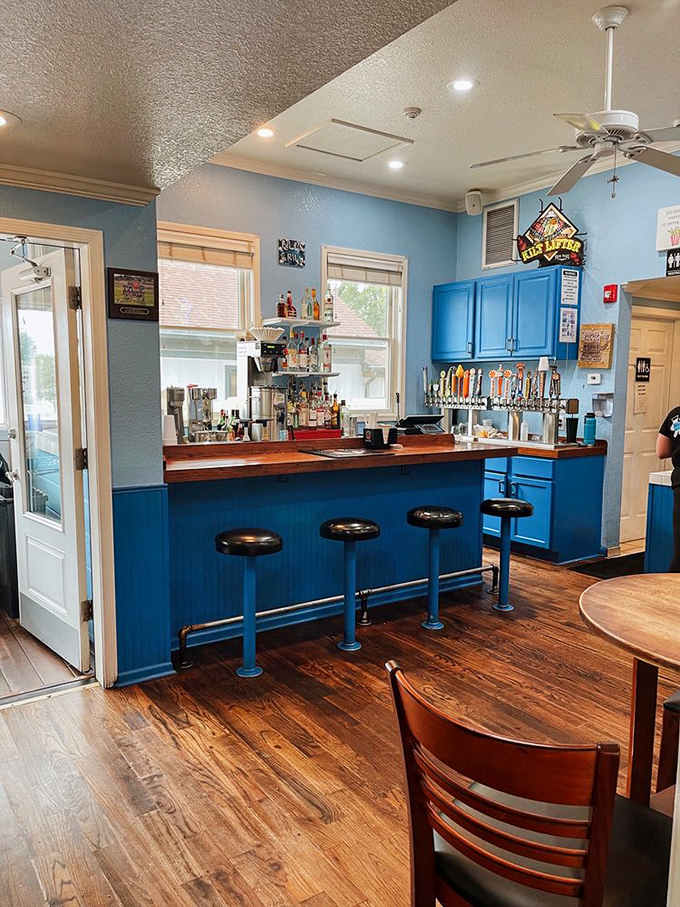 The bright blue bar where dreams are ordered and burgers are born, complete with tap handles and good vibes.