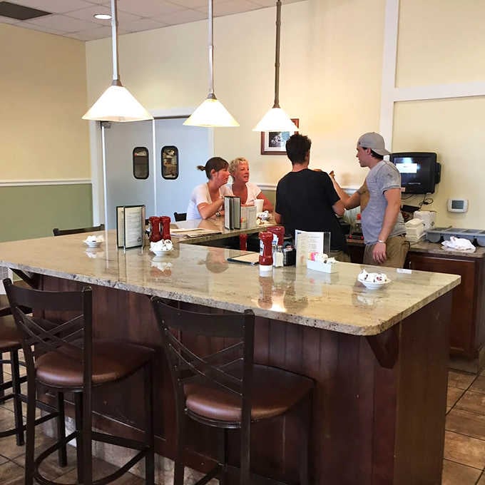 The counter seating offers front-row views of the kitchen action and prime real estate for pie-related decision making with fellow diners.