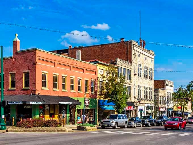 Stroll through vibrant downtown Bloomington, where colorful historic storefronts and charming local shops create the perfect sunny afternoon atmosphere.