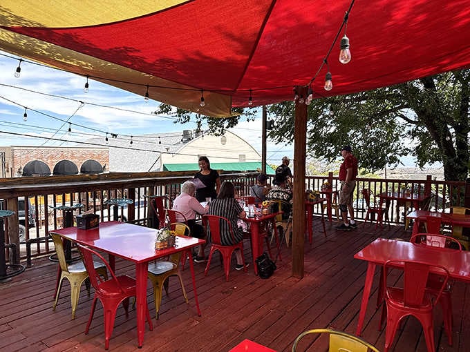 Outdoor seating with valley views that make you understand why people fought to keep this town alive.