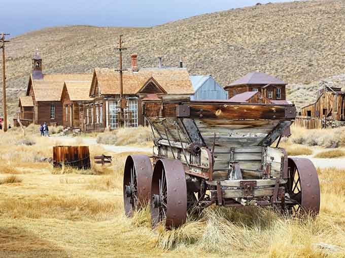 This ore wagon hauled dreams of fortune across these dusty streets when gold fever gripped every soul here.