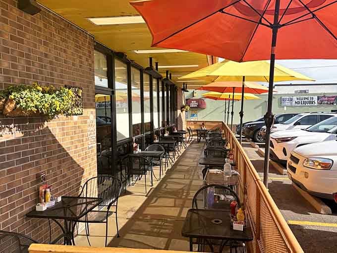 Patio seating under bright umbrellas for those Colorado mornings when eating outside feels like winning the weather lottery.