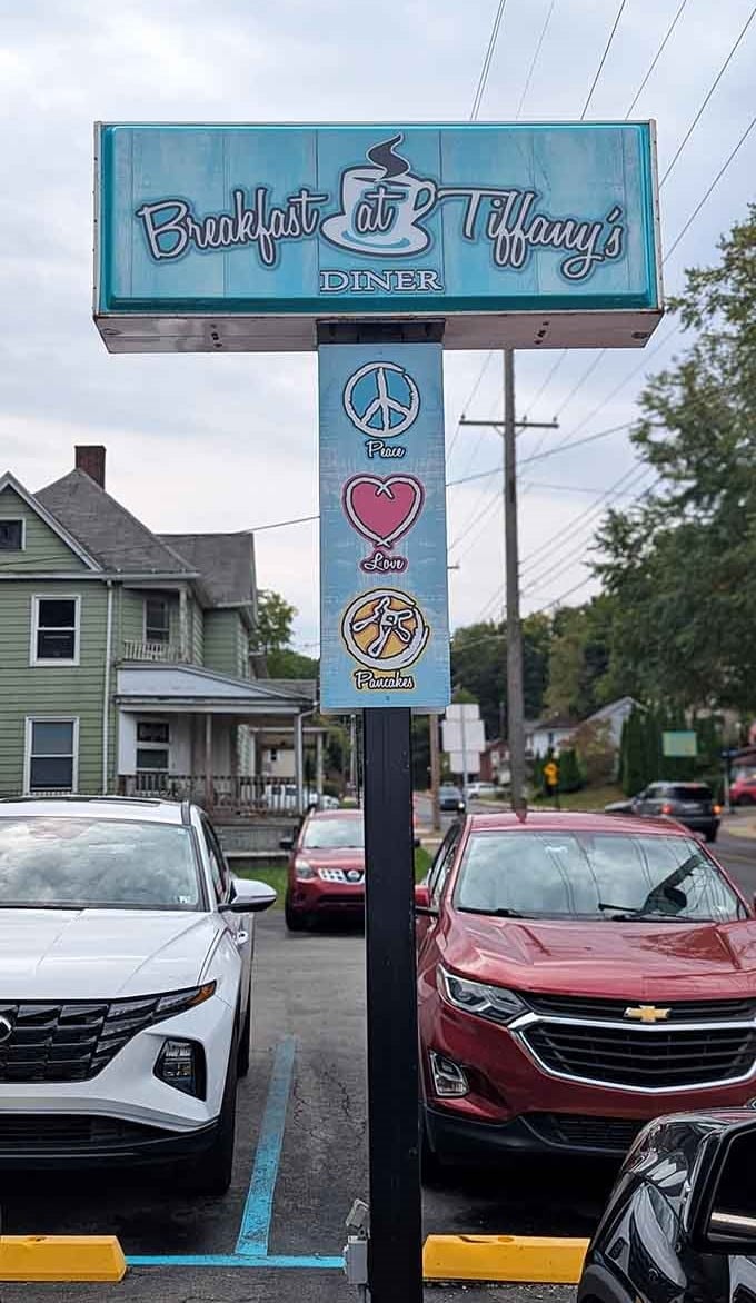 Peace, love, and pancakes on the roadside sign isn't just clever marketing, it's a genuine breakfast philosophy.