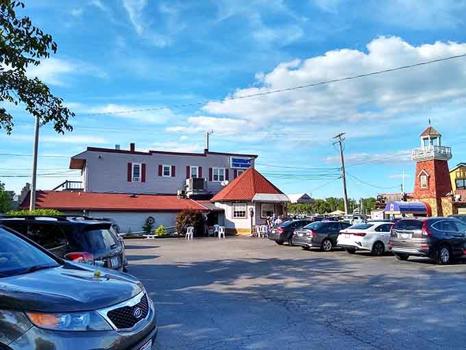 Cars fill the lot like seagulls around a fishing boat, everyone chasing the same delicious dream.