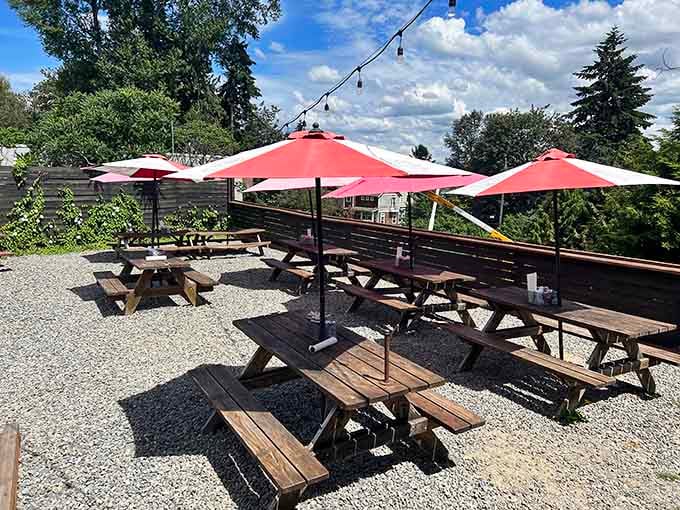 Outdoor patio seating with bright umbrellas lets you enjoy your barbecue feast under Washington's beautiful summer skies.