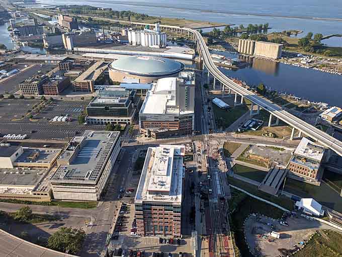 The aerial perspective reveals a city reborn, where waterfront development and urban renewal create opportunities for smart investors.