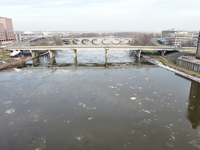 Winter's icy grip can't diminish the bridge's dignified presence, standing sentinel over the frozen landscape below.
