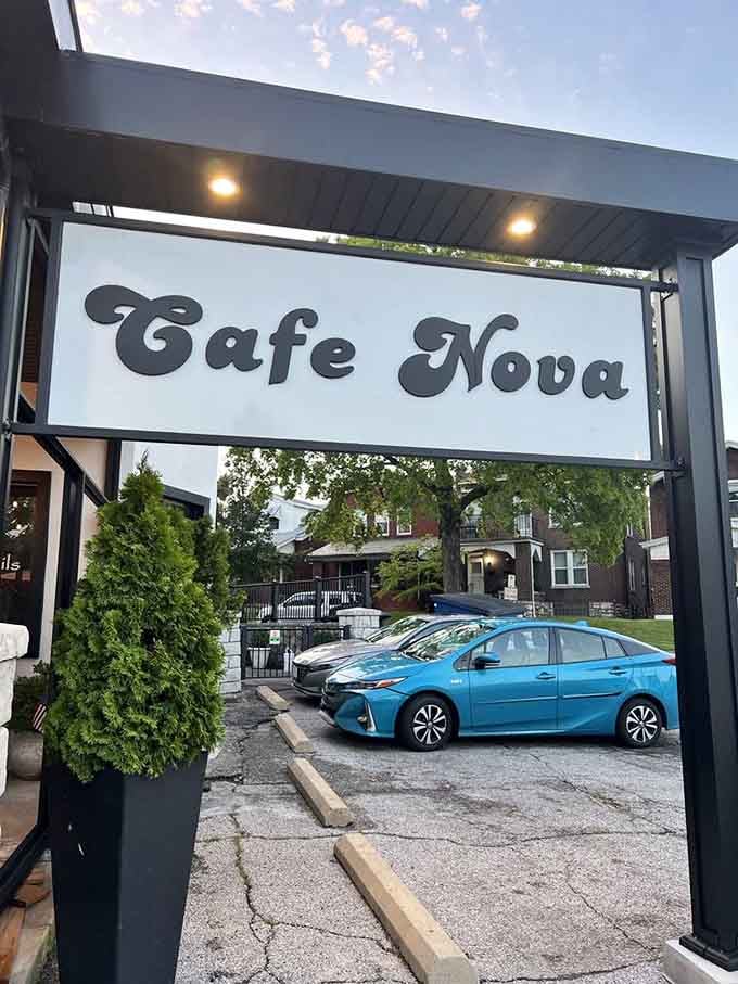 Evening light filtering through that elegant entrance frame, beckoning you inside like a dinner invitation you can't possibly refuse.