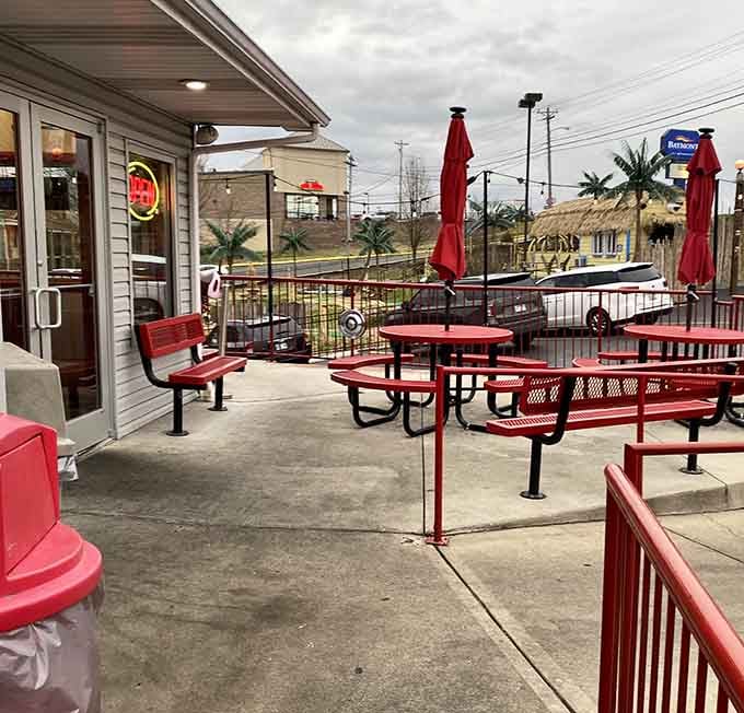 Outdoor seating with bright red tables means you can enjoy your burger while watching the world go by, fifties style.
