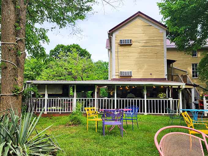 Rainbow-colored chairs scattered across the lawn invite you to sit, relax, and remember what unhurried afternoons feel like.
