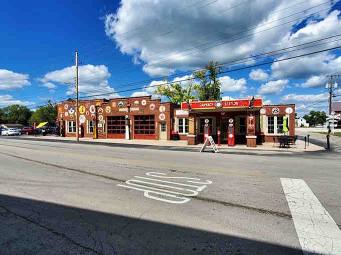 The full exterior view showcasing those vintage gas pumps standing proud, promising an experience that's authentically different from chain restaurants.