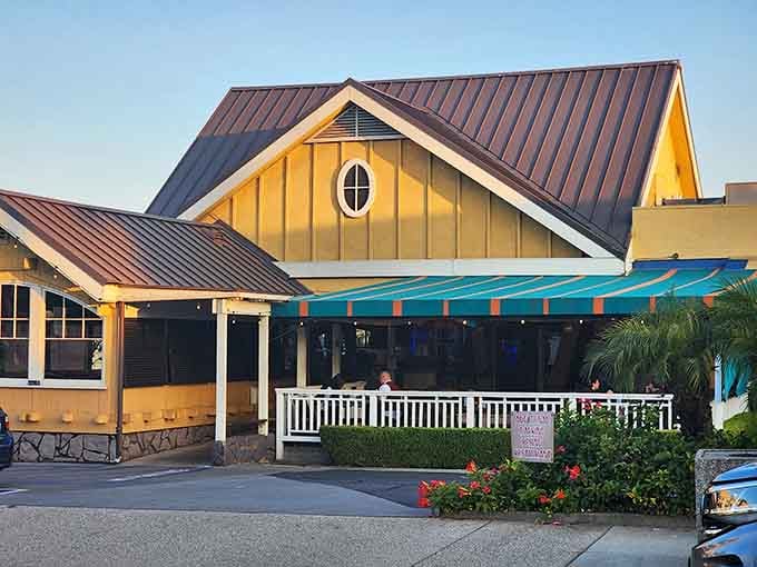 The storefront at dusk looks inviting and warm, like a beacon calling you home after a long day of pretending to work.