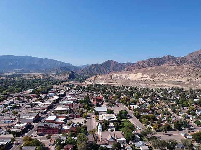 Aerial views reveal how mountains cradle this town, nature's way of giving the whole community a permanent hug.