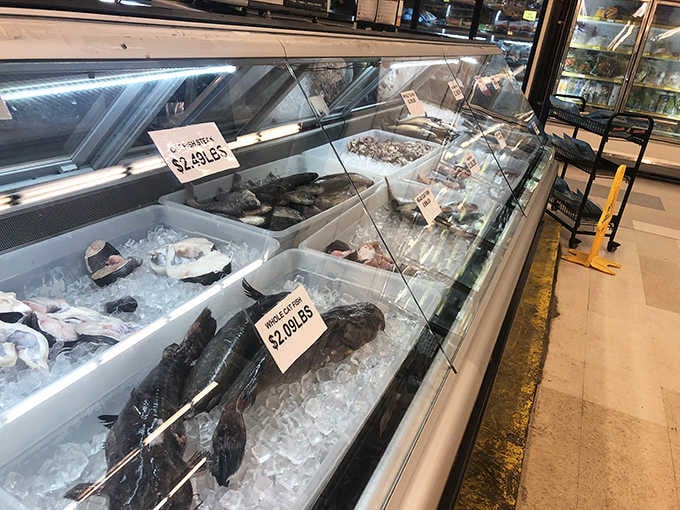 Fresh whole fish rest on ice like ocean jewels, ready to star in tonight's dinner if you're feeling adventurous.