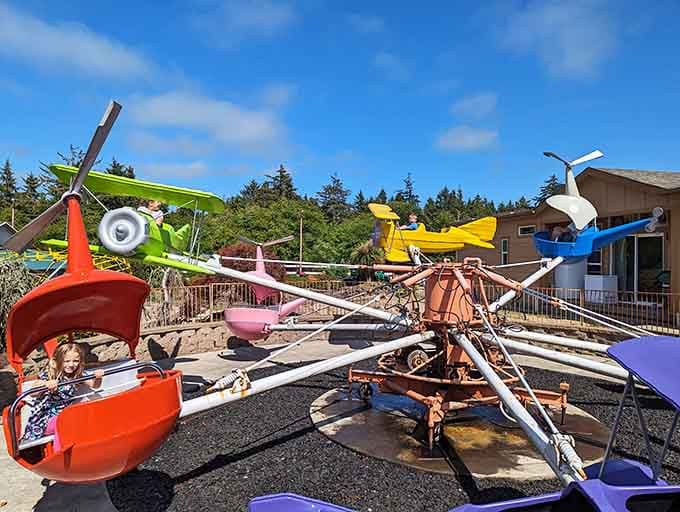 Miniature airplanes lift young pilots skyward, fulfilling dreams of flight without leaving solid Oregon ground.