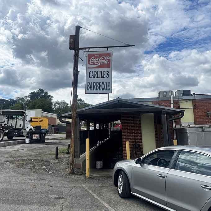 That roadside sign has been calling hungry travelers home to real Alabama barbecue for generations now.