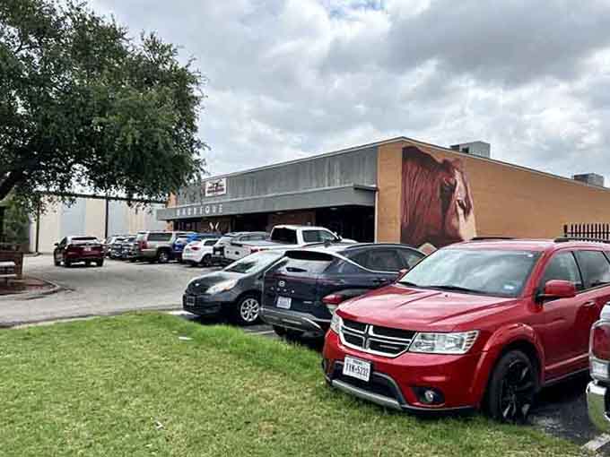 That packed parking lot tells you everything you need to know before you even smell the smoke.