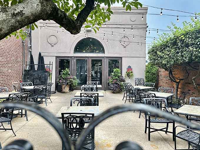 The patio offers al fresco dining under the trees, because sometimes Missouri weather cooperates with your dinner plans.