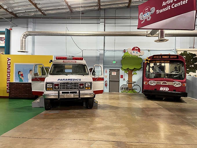 Real emergency vehicles transformed into interactive exhibits where kids learn about community helpers while having the time of their lives.